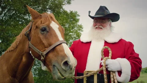 Santa Clause dressed as a cowboy with a ... | Stock Video | Pond5