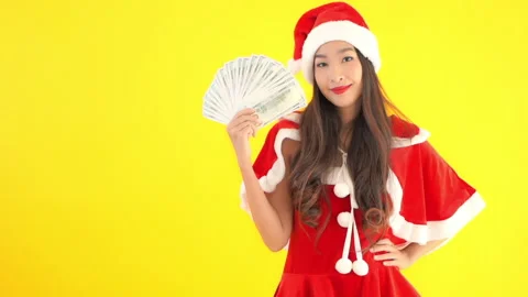 Santa's helper fans herself with a sprea... | Stock Video | Pond5