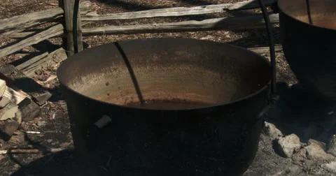Sap boiling in old metal pots to produce... | Stock Video | Pond5