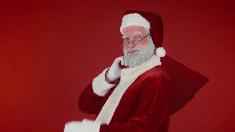 Sassy Santa Claus Posing with Sack of Pr... | Stock Video | Pond5