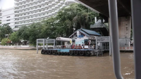 Sathorn ferry pier on the Chao Phraya Ri... | Stock Video | Pond5