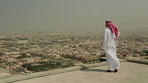 Saudi Arabian man standing on a roof in ... | Stock Video | Pond5
