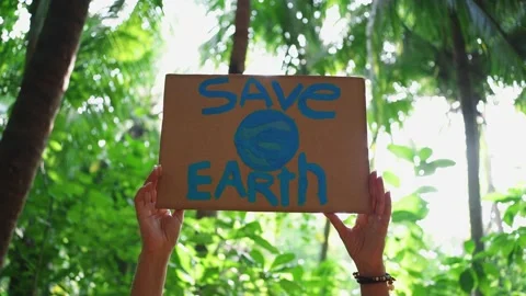 "Save the Earth" poster in hands close-u... | Stock Video | Pond5