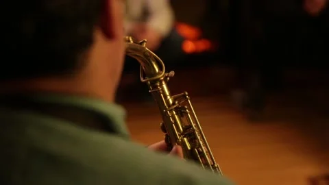 Saxophonist is playing his sax with fire... | Stock Video | Pond5