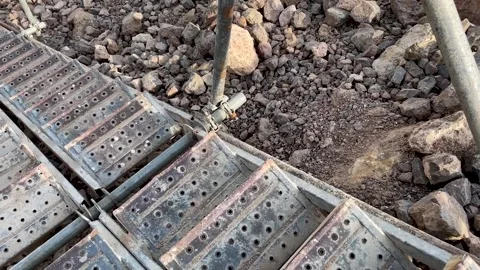 scaffold stair installed on a dirt slope... | Stock Video | Pond5