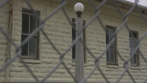 Scan Of Prison Through Chain Link Fence | Stock Video | Pond5