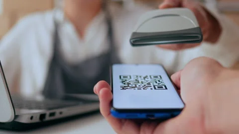 Scanning a QR code on a smartphone scree... | Stock Video | Pond5
