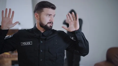 Scared Caucasian police officer standing... | Stock Video | Pond5