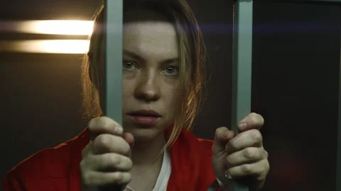 Scared female prisoner in handcuffs look... | Stock Video | Pond5
