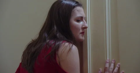 Scared girl checking door and listening ... | Stock Video | Pond5