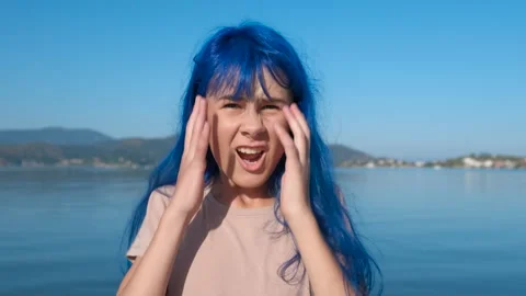 Scared girl on sea shore. | Stock Video | Pond5