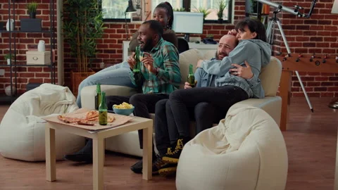 Scared group of friends watching horror ... | Stock Video | Pond5