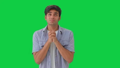 Scared Indian boy praying to God Green s... | Stock Video | Pond5