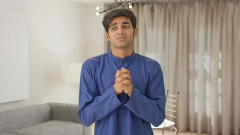 Scared Indian man praying to God | Stock Video | Pond5