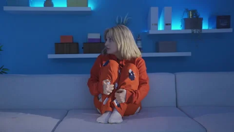 Scared woman at home alone at night. Psy... | Stock Video | Pond5