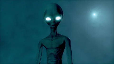 Scary gray alien standing and blinking a... | Stock Video | Pond5