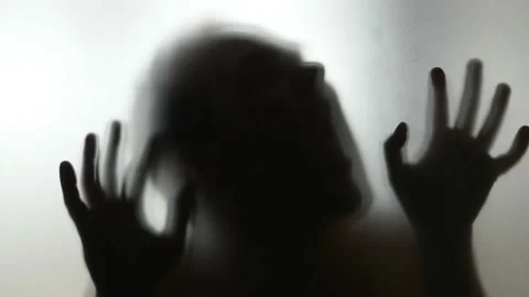Scary human behind frosted glass in 4k s... | Stock Video | Pond5