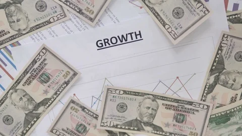 Scattered Dollars on Growth Chart on Des... | Stock Video | Pond5