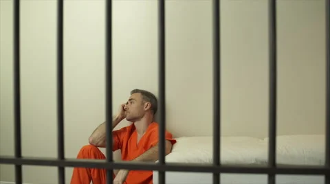 Scene of a morose inmate in prison | Stock Video | Pond5
