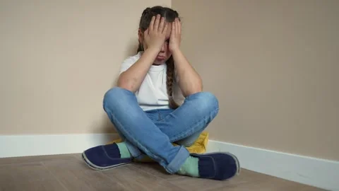 School-age child is sad in corner of roo... | Stock Video | Pond5