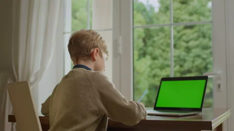 School boy talking to laptop green scree... | Stock Video | Pond5