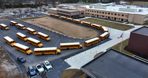 School bus line up and wait for children... | Stock Video | Pond5