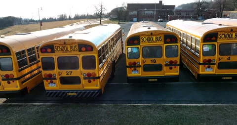 School bus line up. Rising aerial reveal... | Stock Video | Pond5