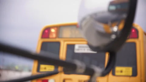 School bus rack focus at lineup outside ... | Stock Video | Pond5