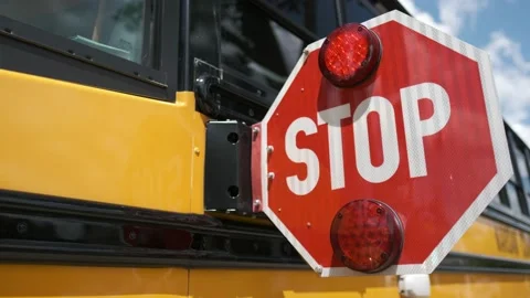 School bus with stop sign extended and f... | Stock Video | Pond5