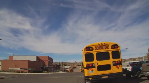 School Buses Approaching High School In ... | Stock Video | Pond5