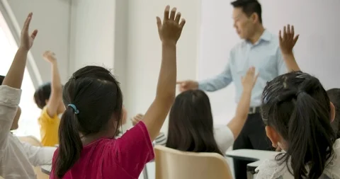 School children answer questions in clas... | Stock Video | Pond5