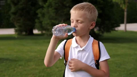 School children drink water from small b... | Stock Video | Pond5