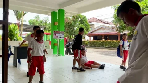 School children play ball while waiting ... | Stock Video | Pond5
