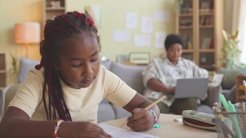 School Girl Doing Math Worksheet at Home | Stock Video | Pond5