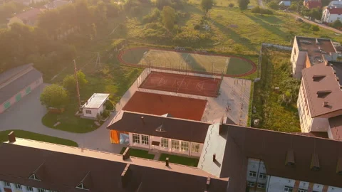 School with green lawn. Public school bu... | Stock Video | Pond5