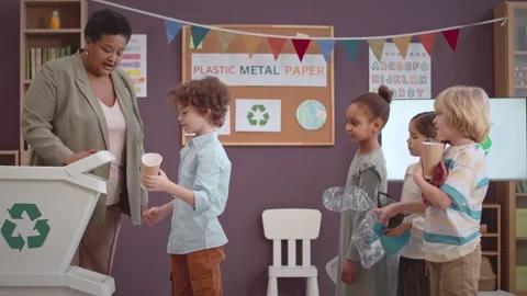 School Kids Sorting Garbage into Contain... | Stock Video | Pond5