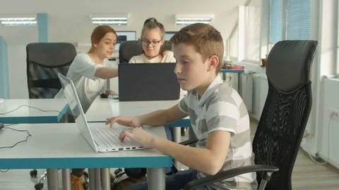 School kids working on laptop computer i... | Stock Video | Pond5