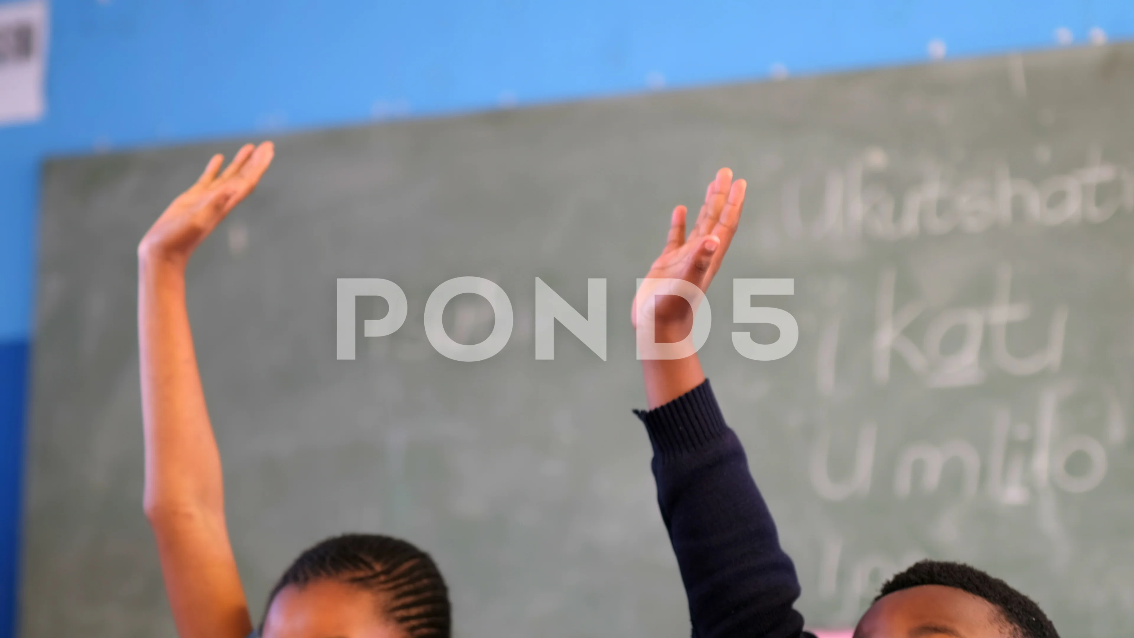 Hands Raised Up In Class