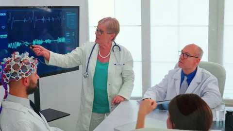 Scientist doing brain analysis using hea... | Stock Video | Pond5