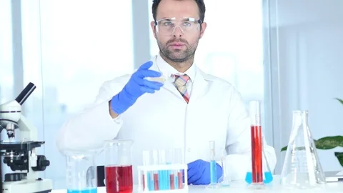 Scientist Examining Reaction in Watch Gl... | Stock Video | Pond5