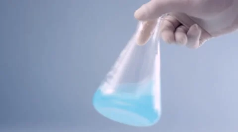 Scientist hand shaking Erlenmeyer flask ... | Stock Video | Pond5
