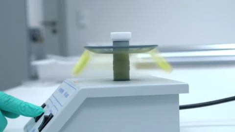 Scientist inserts a test tube into the m... | Stock Video | Pond5