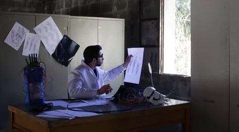 Scientist inventor works in his laborat... | Stock Video | Pond5