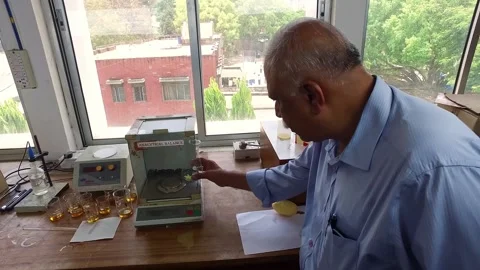 Scientist measuring in analytical balanc... | Stock Video | Pond5