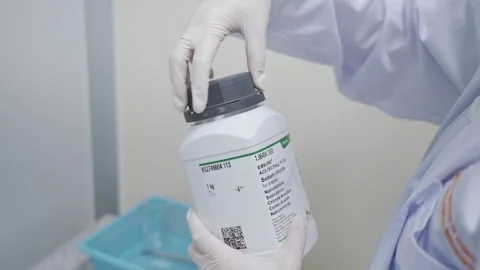 Scientist open Sodium Chloride container... | Stock Video | Pond5