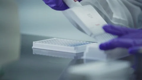 A Scientist performing experiment in a S... | Stock Video | Pond5