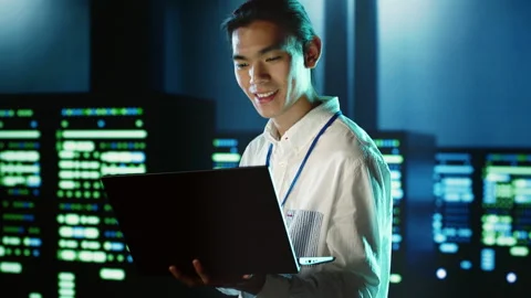 Scientist strolling through data center | Stock Video | Pond5