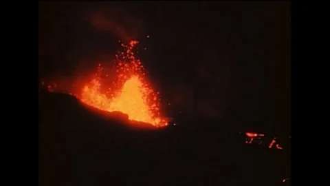 A scientists observes and a river of lav... | Stock Video | Pond5