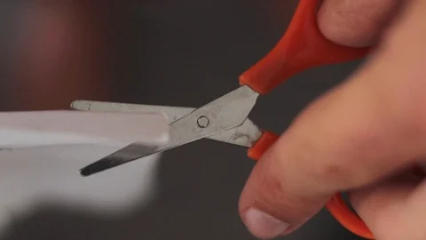 Scissors cut open a paper bag / Top-down... | Stock Video | Pond5