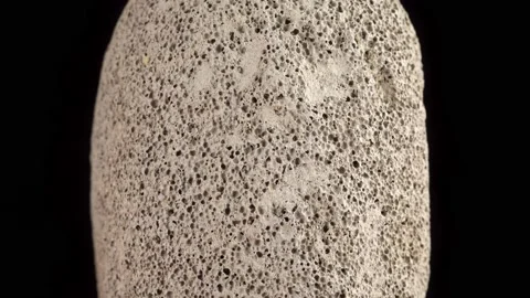 Scoria magma rock close up isolated agai... | Stock Video | Pond5